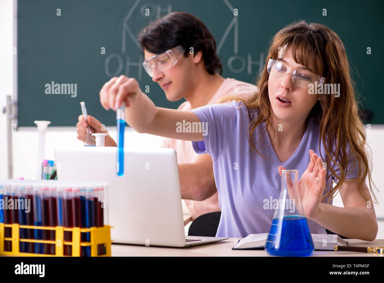 Two chemists students in classroom Stock Photo - Alamy