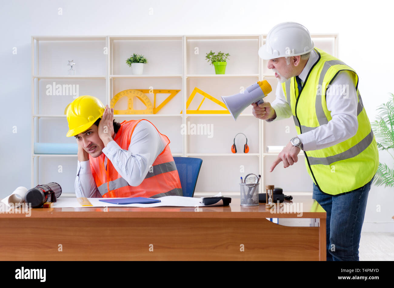Two engineers colleagues working under project Stock Photo - Alamy