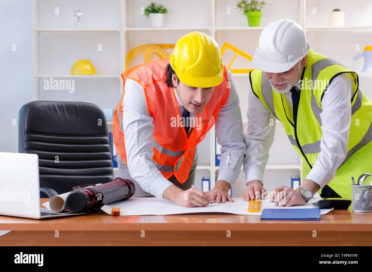 Two engineers colleagues working under project Stock Photo - Alamy