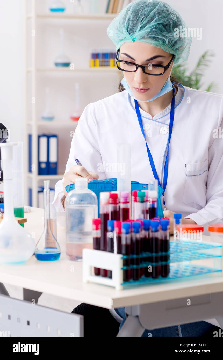 Young female chemist working in the lab Stock Photo - Alamy