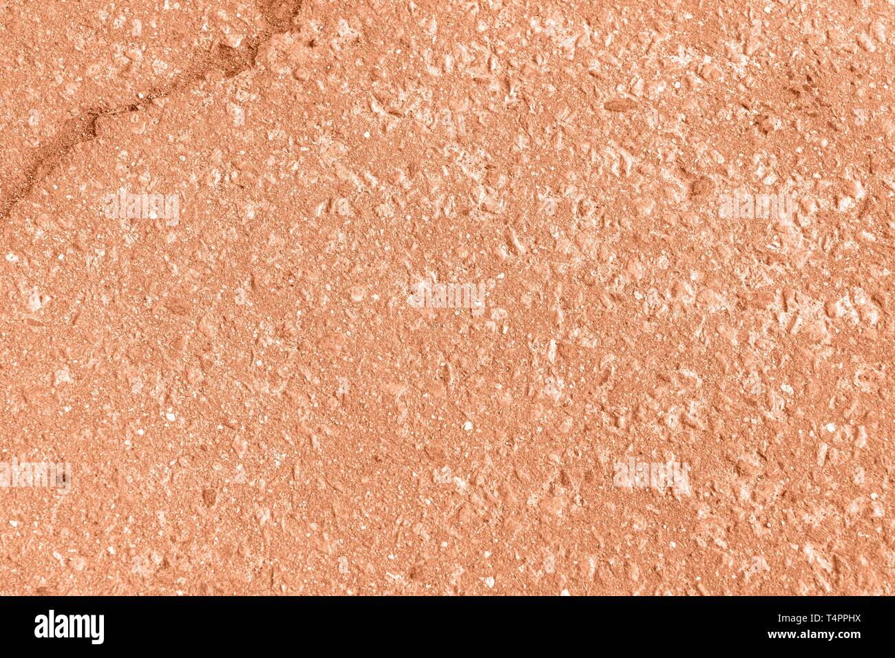 Old asphalt surface texture close up. Orange color toned background ...