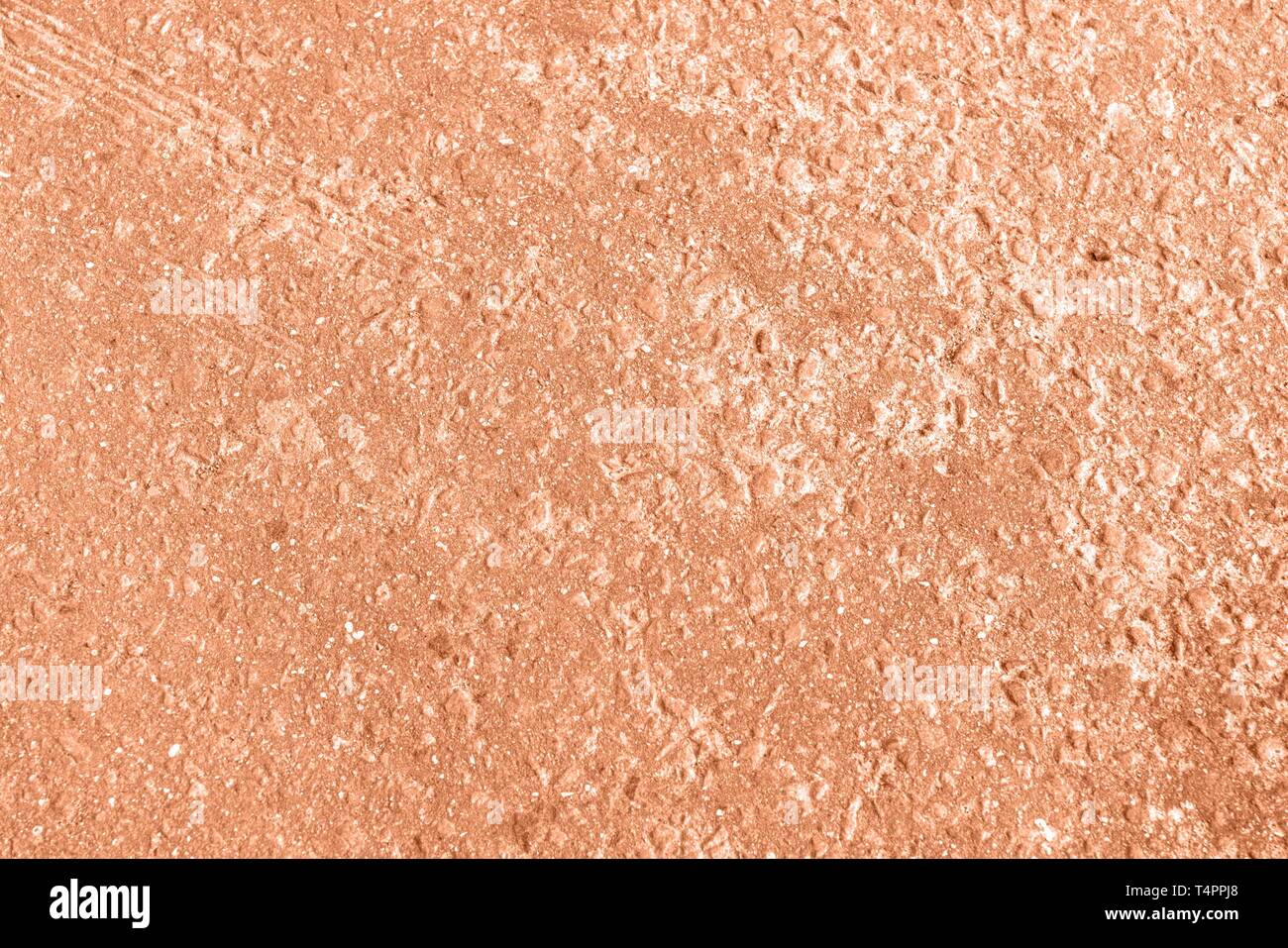 Old asphalt surface texture close up. Orange color toned background ...
