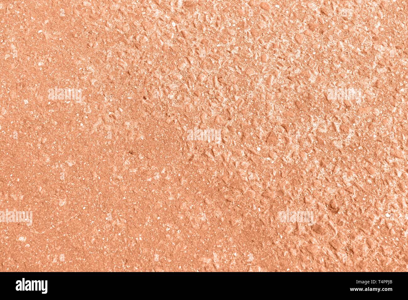Old asphalt surface texture close up. Orange color toned background ...