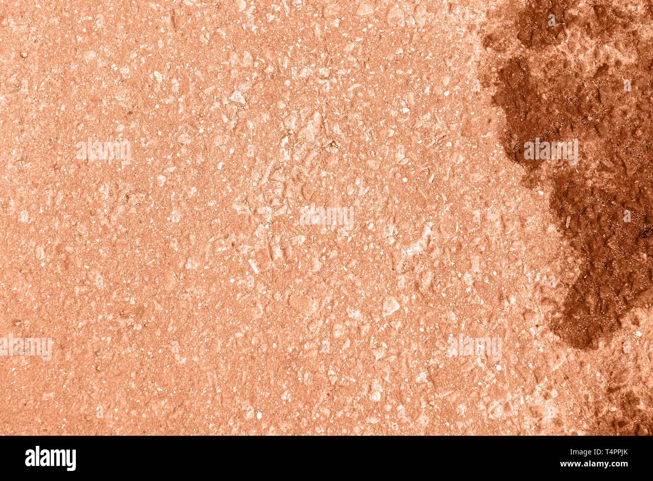 Old asphalt surface texture close up. Orange color toned background ...