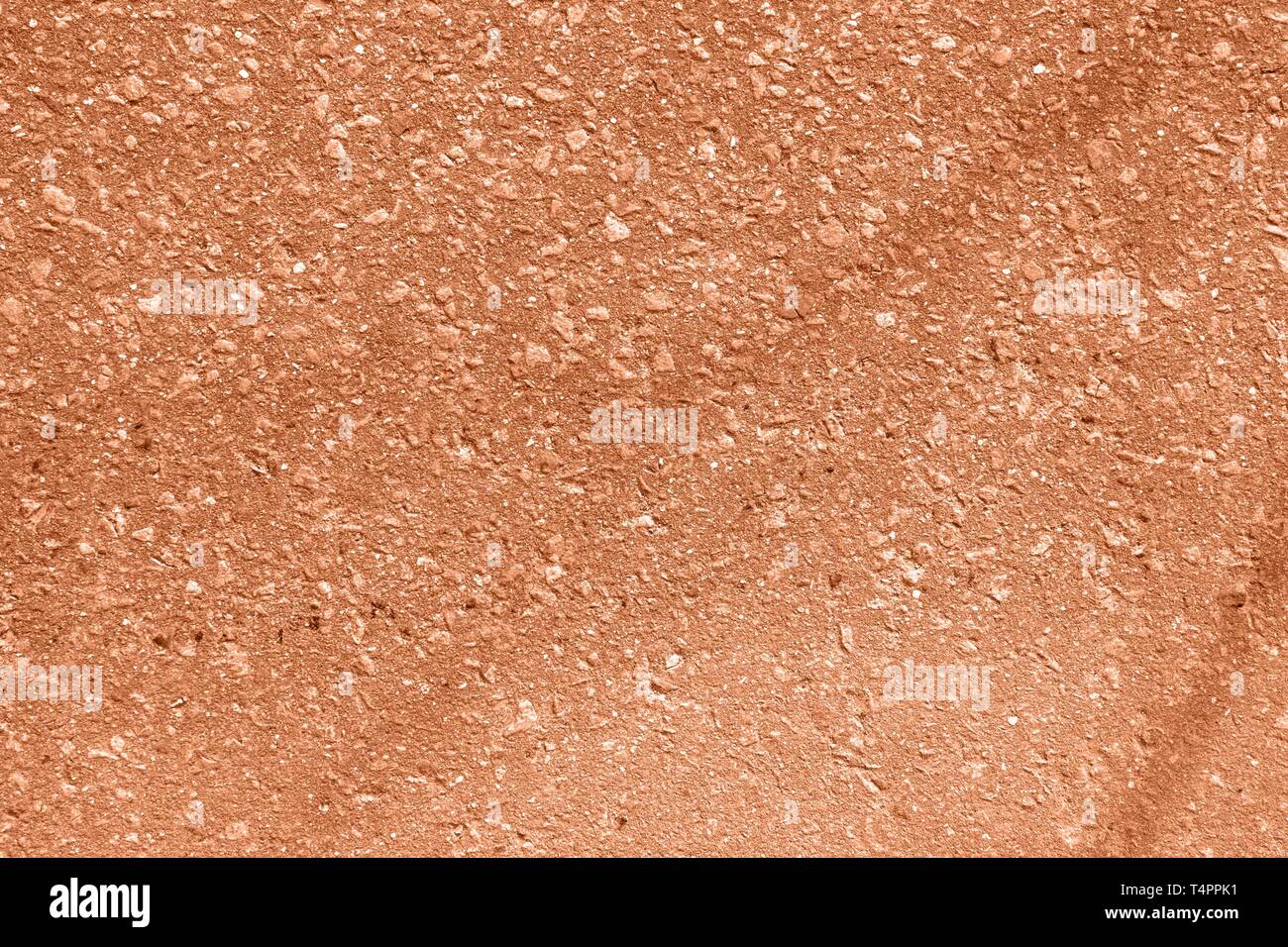 Old asphalt surface texture close up. Orange color toned background ...