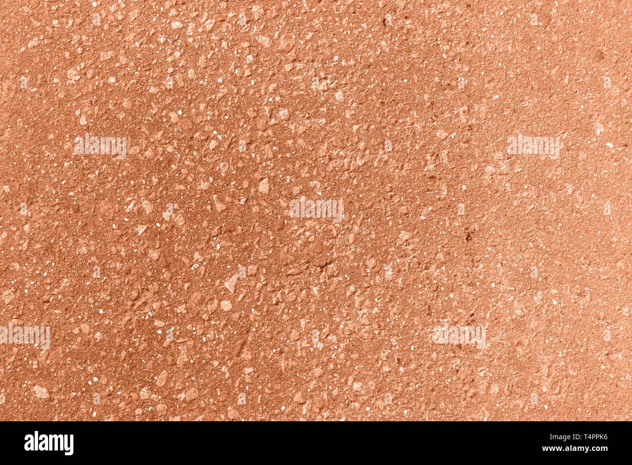 Old asphalt surface texture close up. Orange color toned background ...