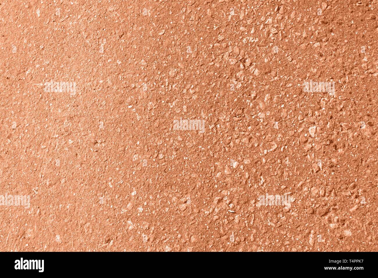 Old asphalt surface texture close up. Orange color toned background ...