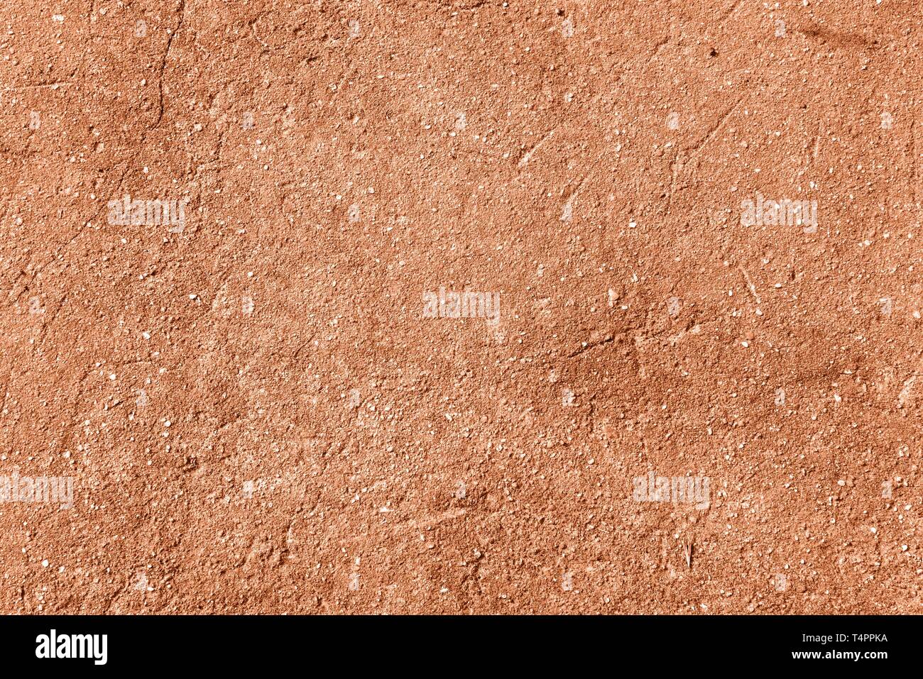 Old asphalt surface texture close up. Orange color toned background ...