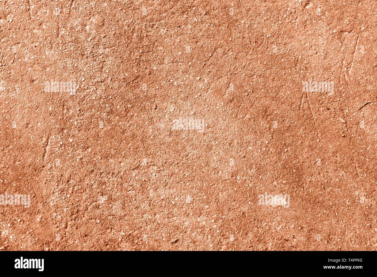 Old asphalt surface texture close up. Orange color toned background ...