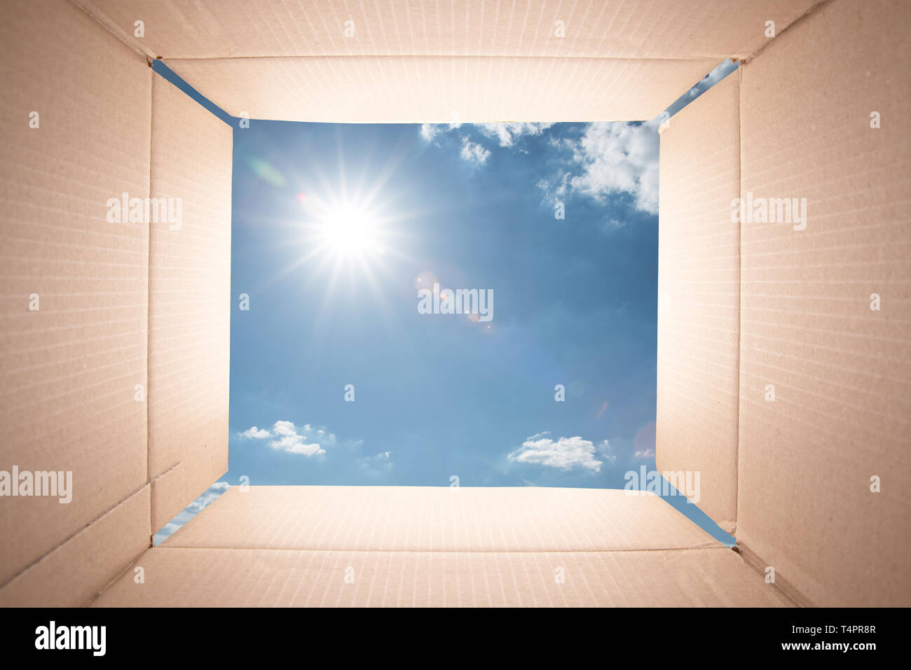 Blue sky viewed from inside of a cardboard box Stock Photo - Alamy