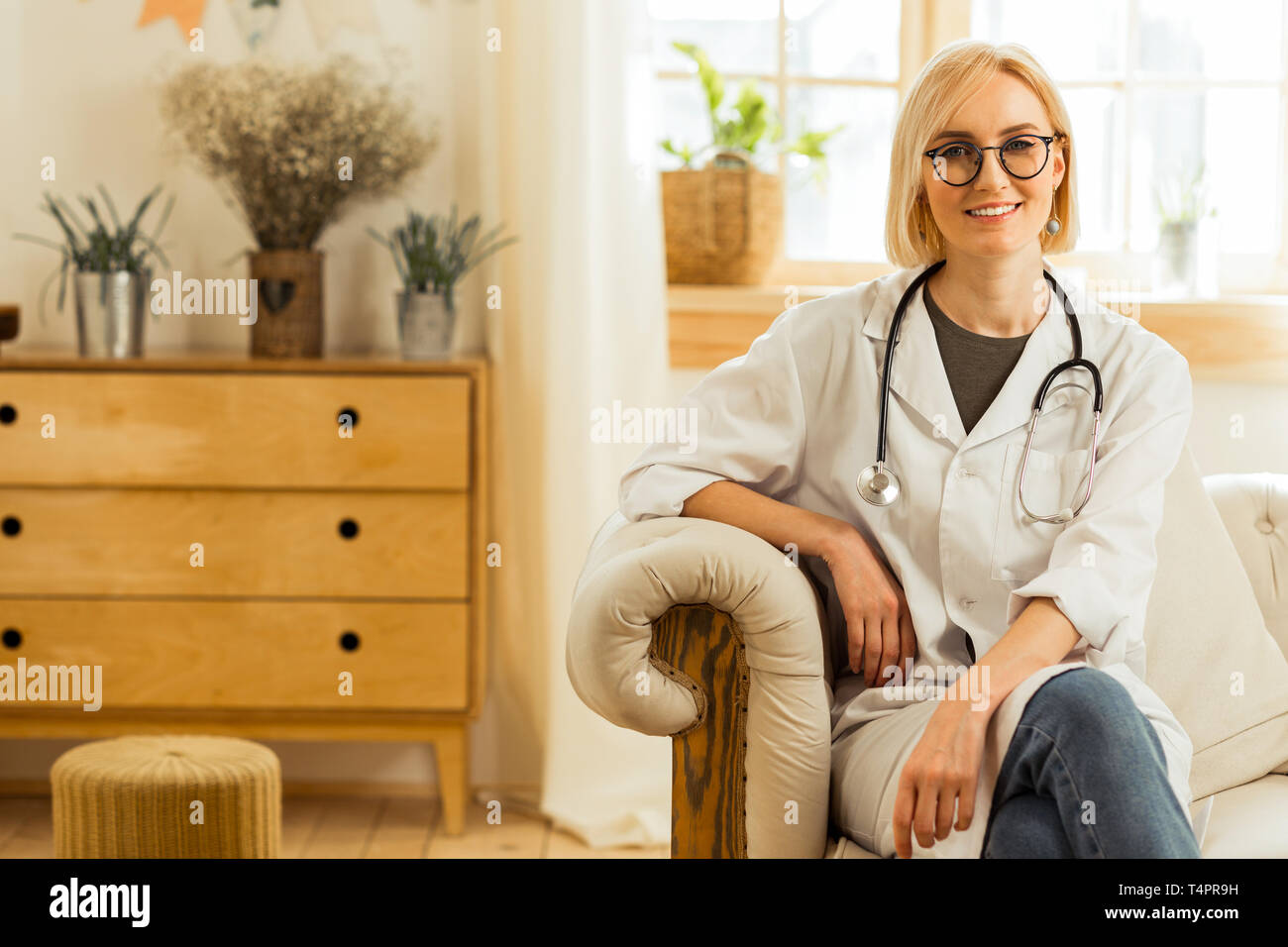 Beaming female doctor. Smiling short-haired blonde charming beautiful ...