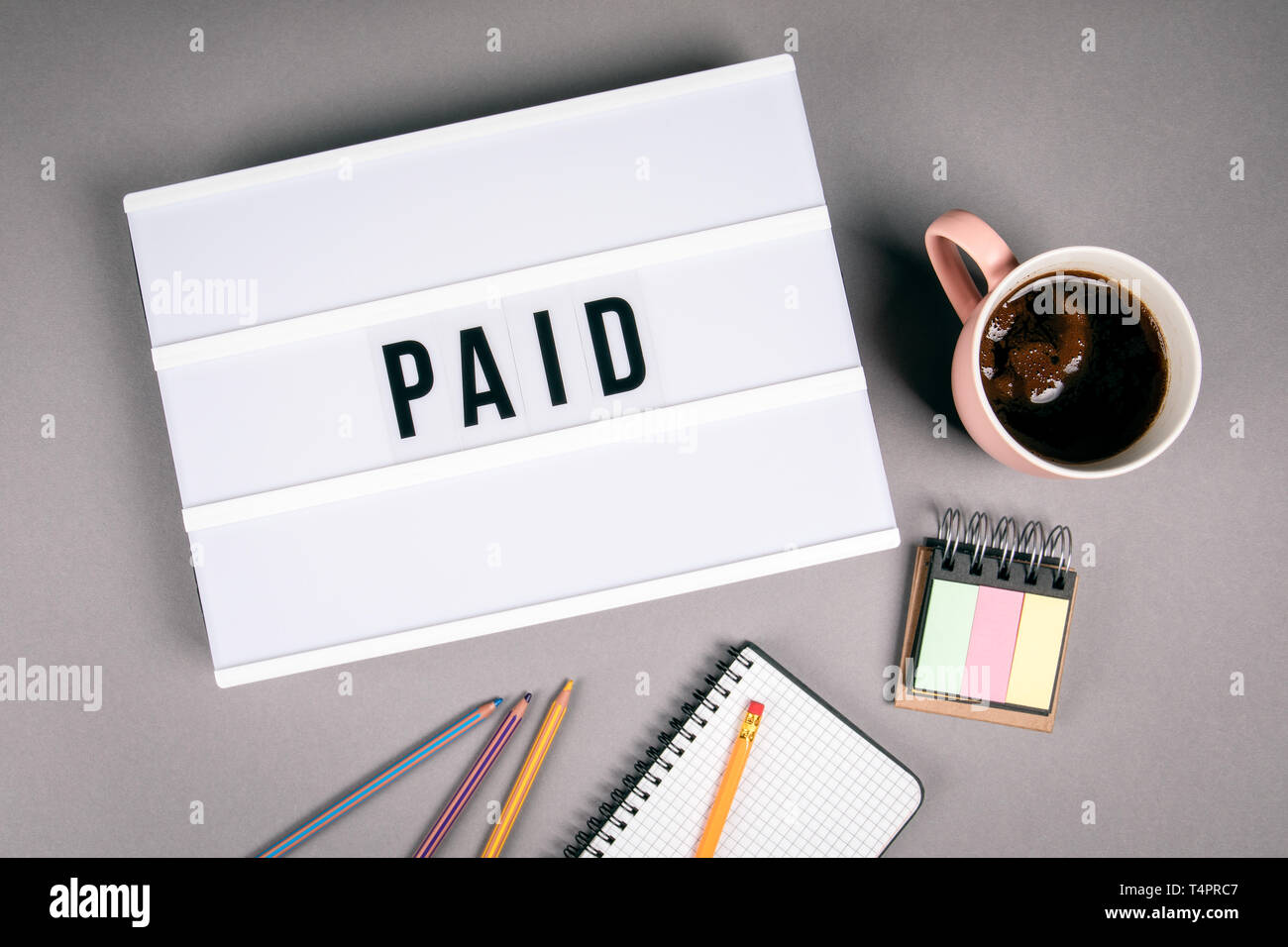 Paid. Text in light box Stock Photo - Alamy