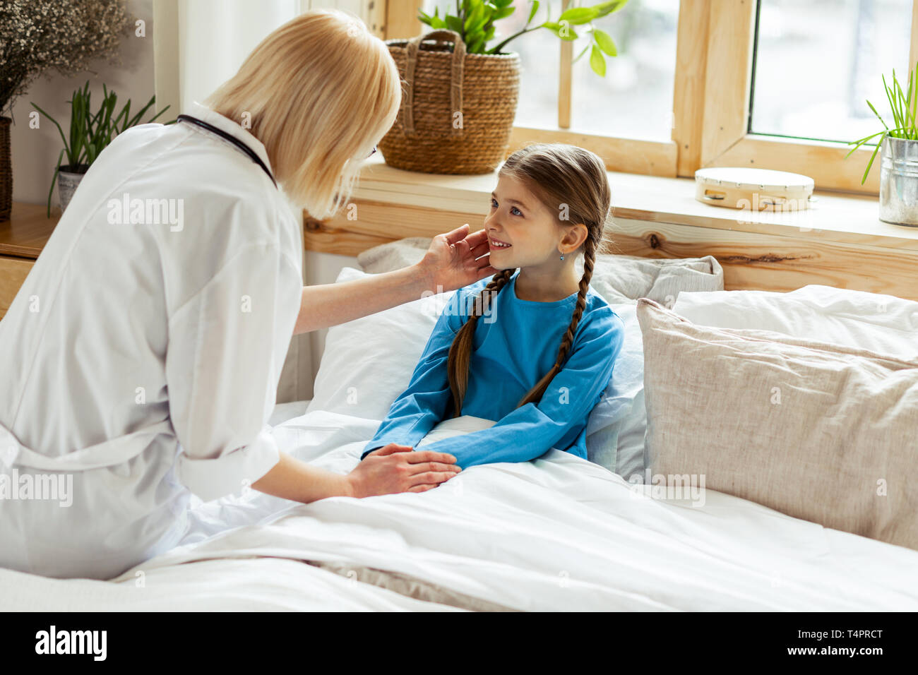 A smiling patient. A cute sweet sick girl with long braids smiling ...
