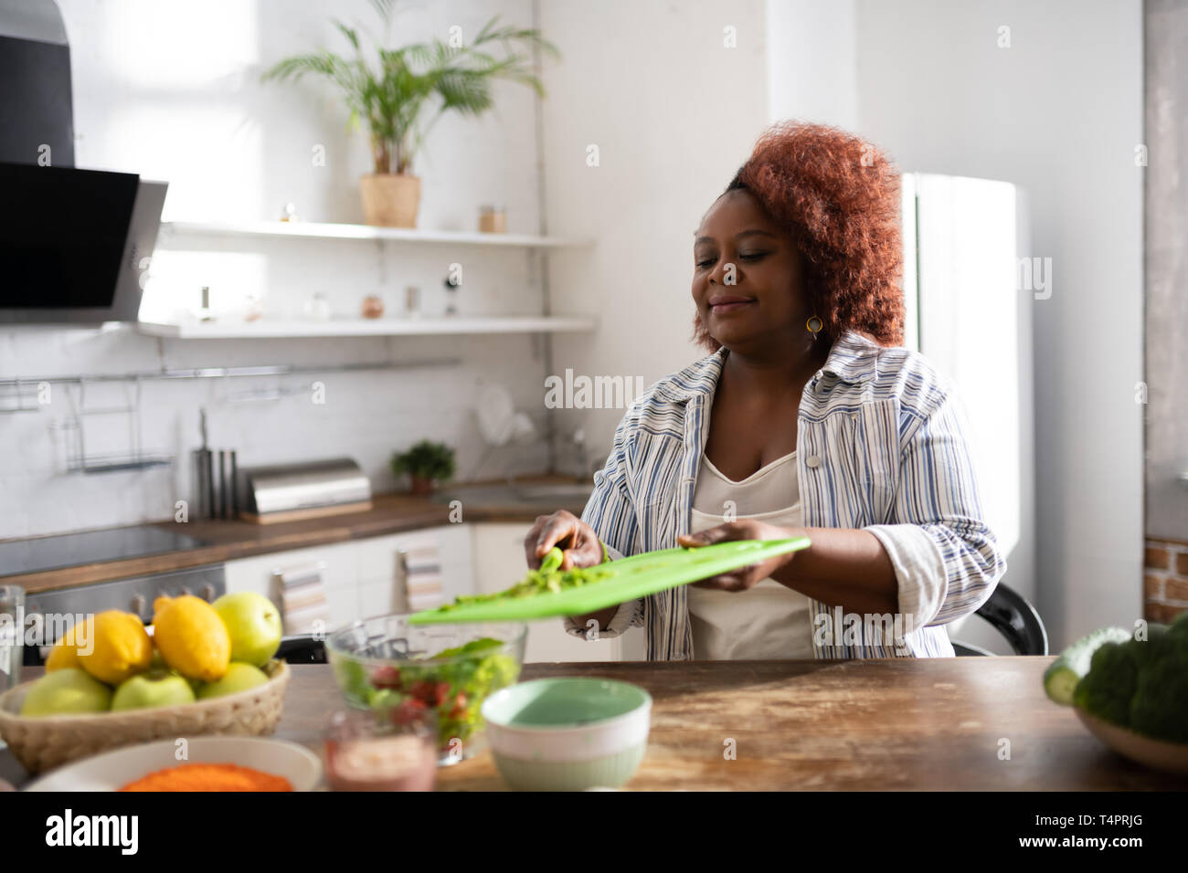 It is my hobby. Kind international woman keeping smile on her face ...