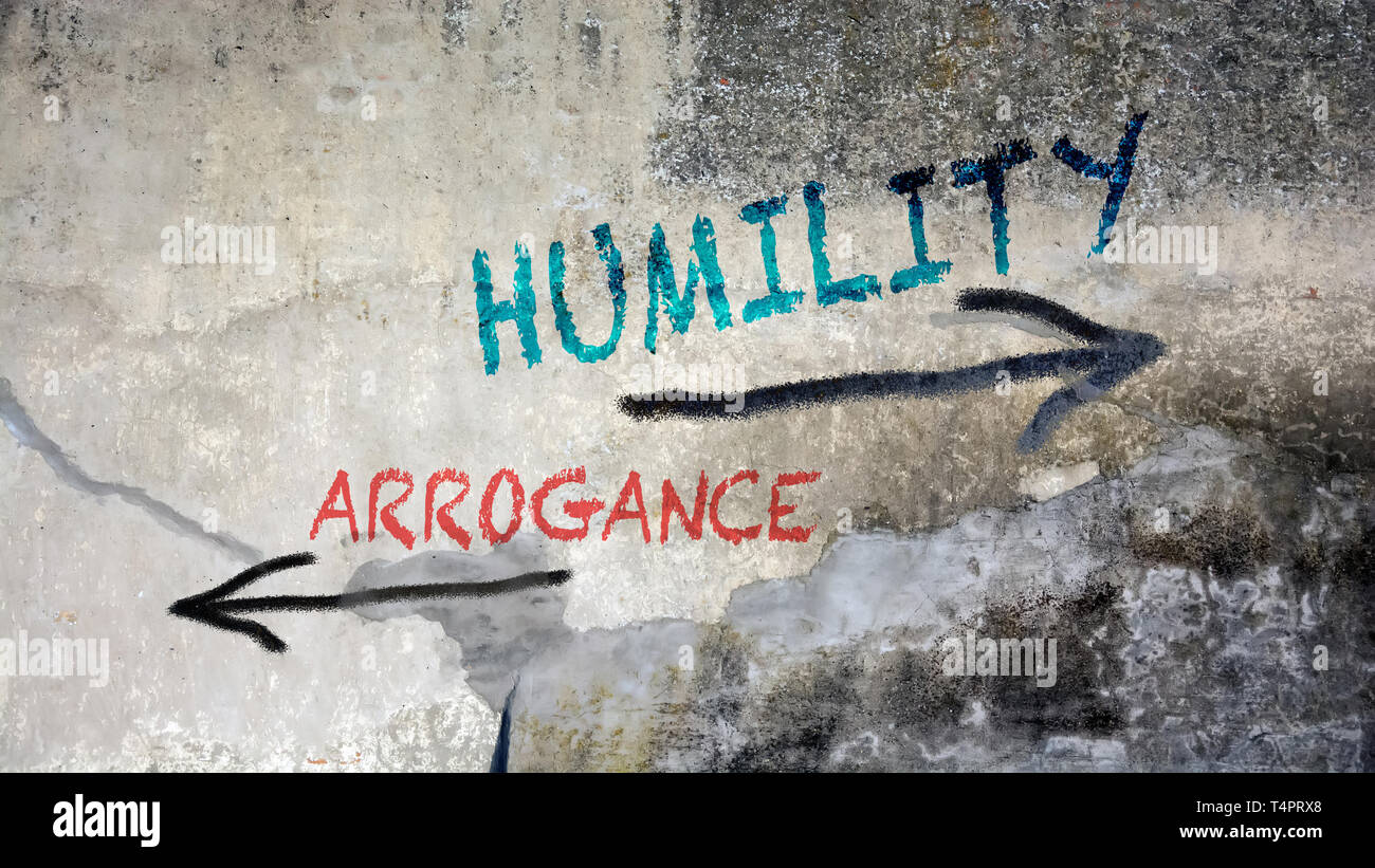 Street Graffiti Humility versus Arrogance Stock Photo - Alamy