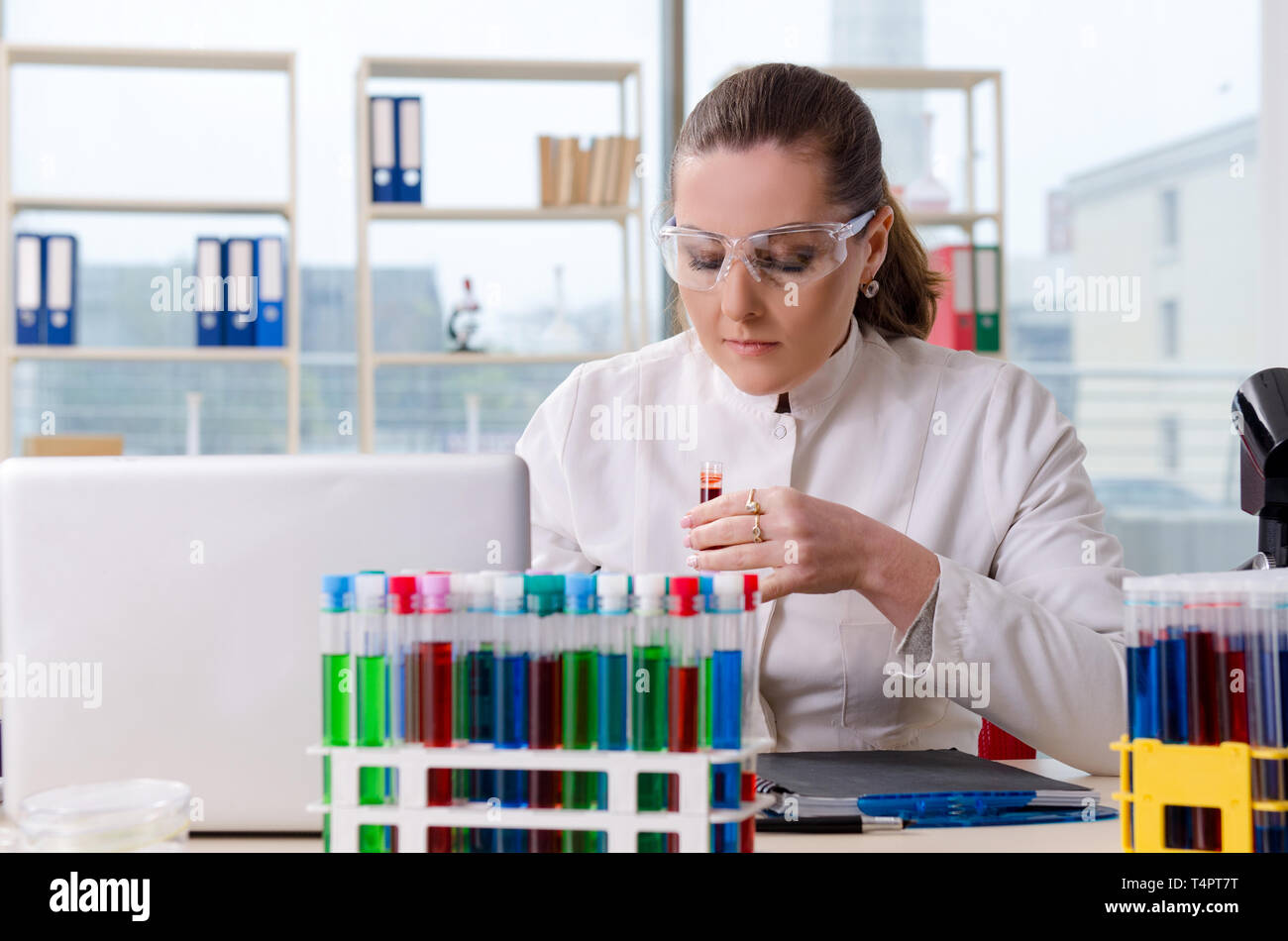 Female chemist working in medical lab Stock Photo - Alamy