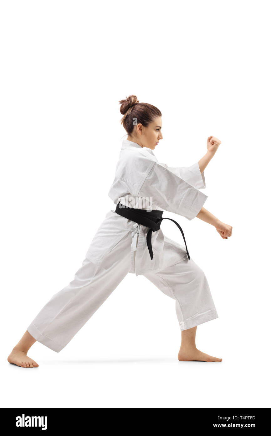 Full length profile shot of a female practicing karate isolated on ...