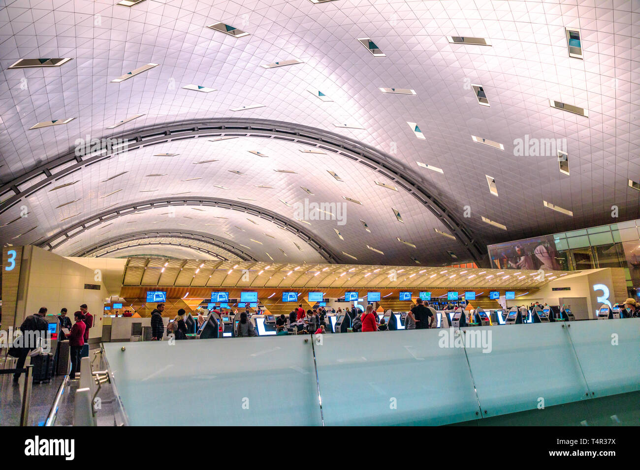 Doha, Qatar - February 24, 2019: Qatar Airways check-in passengers in ...