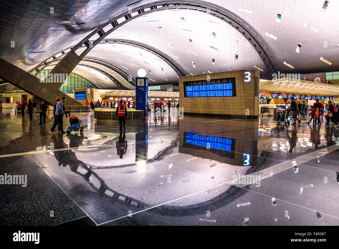 Doha, Qatar - February 24, 2019: Qatar Airways' check-in passengers in ...