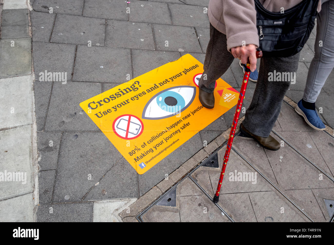 Using mobile crossing road hi-res stock photography and images - Alamy