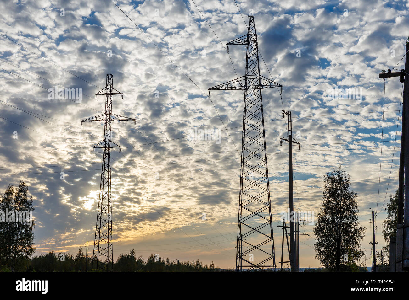 high-voltage power lines, power line towers against a cloudy sky Stock ...