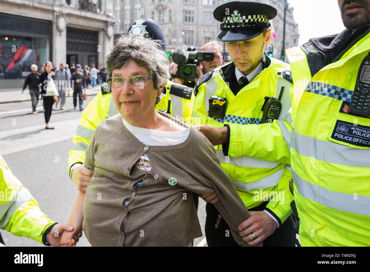 London, UK. 18th April 2019. Police officers move in to arrest a ...
