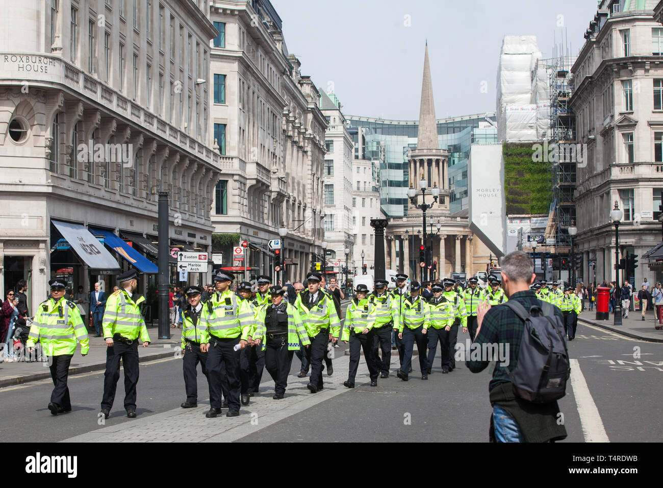 London, UK. 18th April 2019. Police officers move in to arrest climate ...