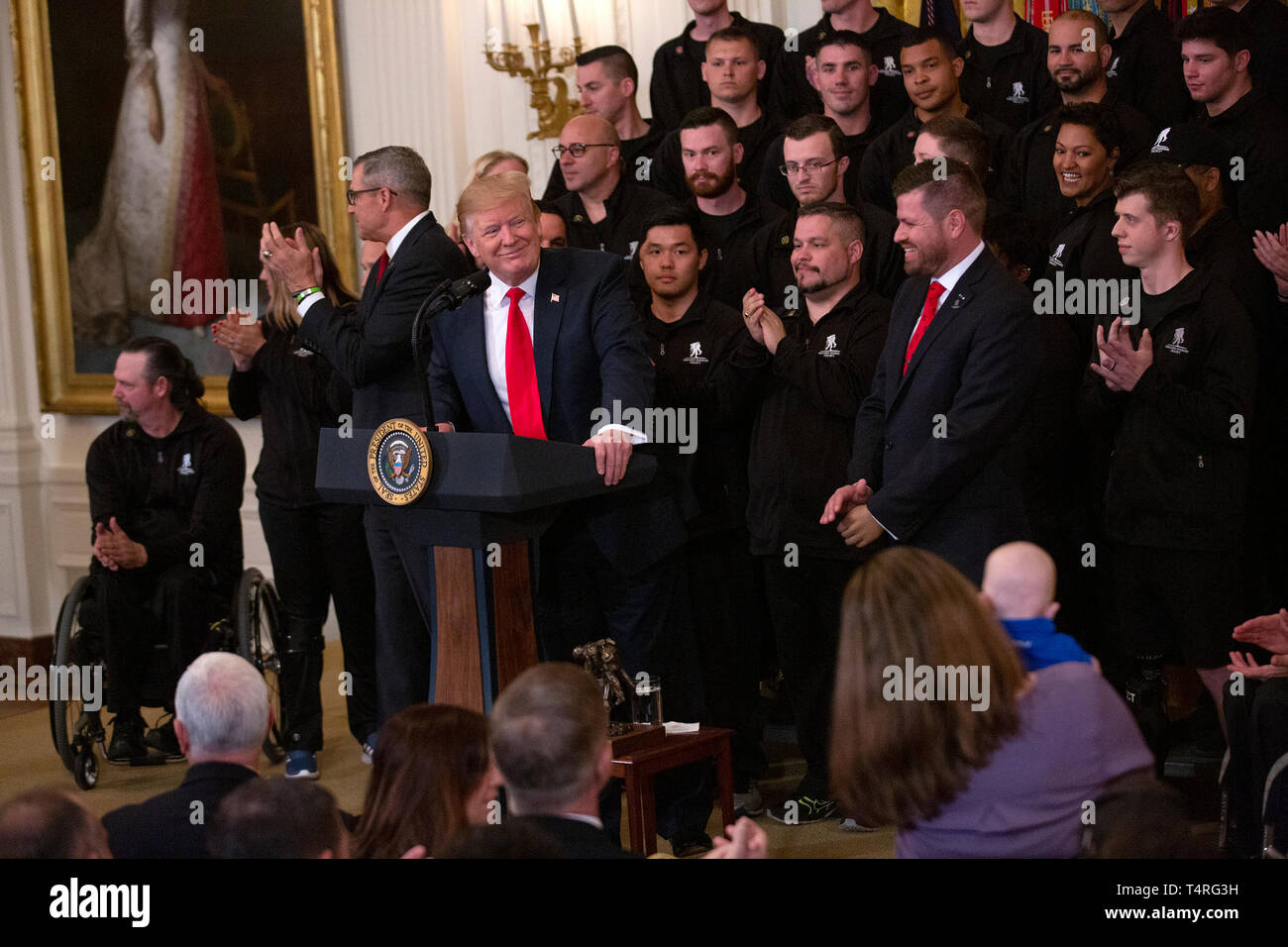 United States President Donald J. Trump smiles at the baby of a wounded ...