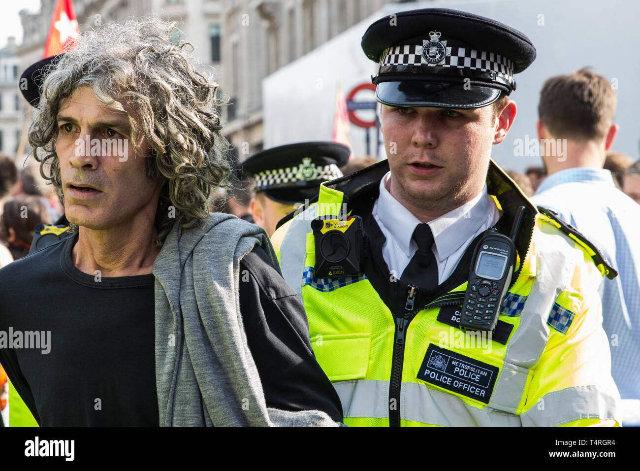 London, UK. 18th April 2019. Police officers arrest a climate change ...