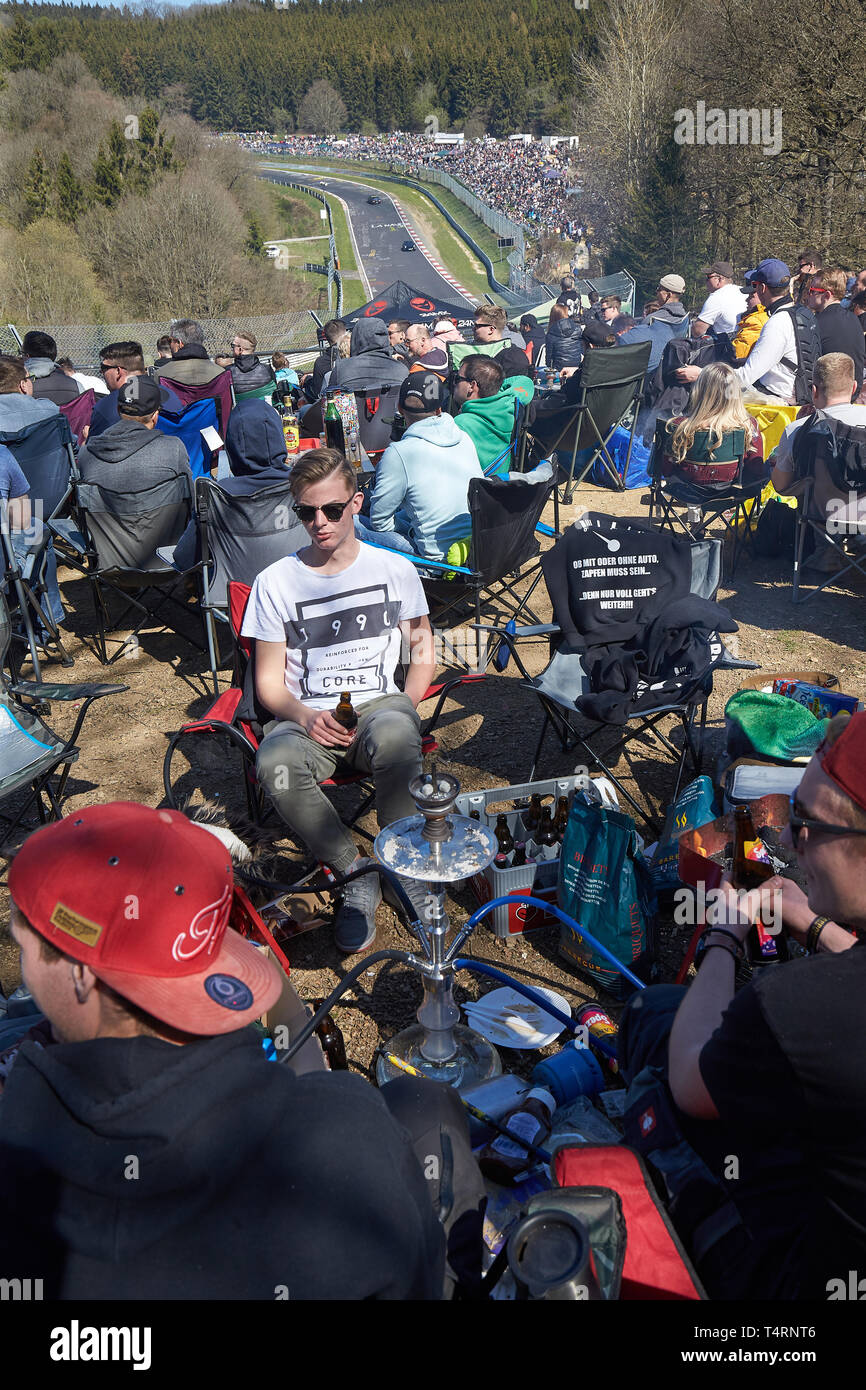 19 April 2019, Rhineland-Palatinate, Nürburg: Motorsport fans crowd ...