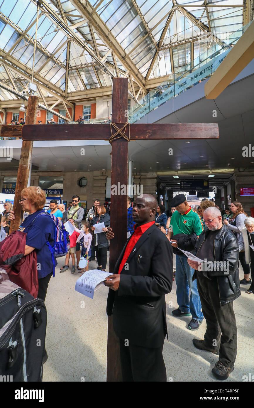 London, UK. 19th Apr, 2019. Members of Southwark churches carry wooden ...
