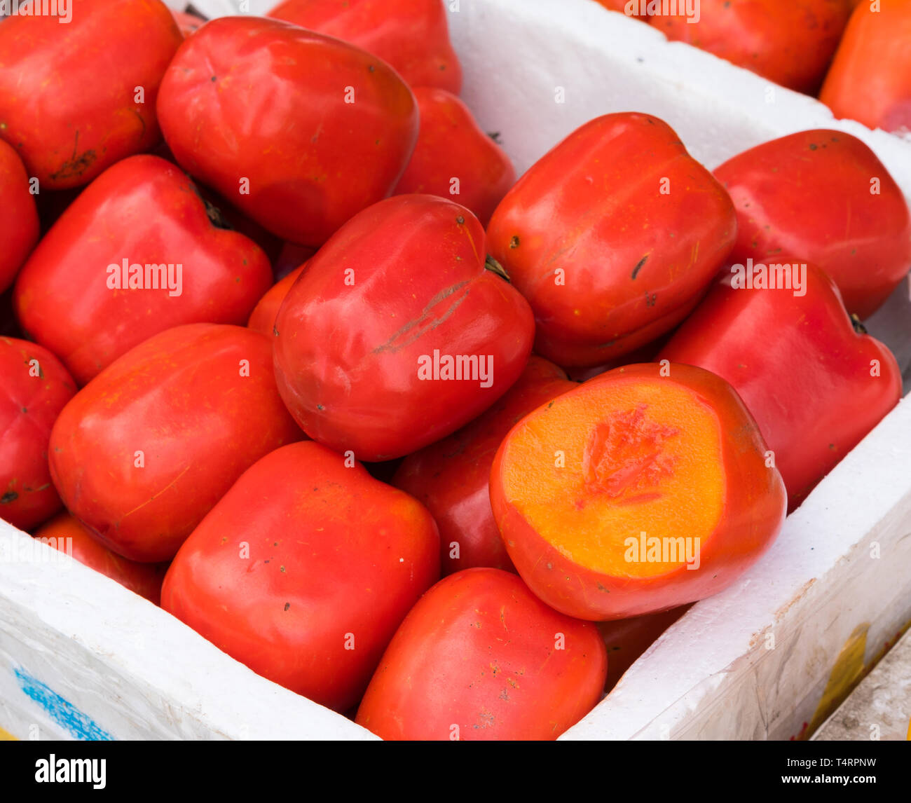 Persimmon, tropical fruit displayed at Vinh Long fruit market, Mekong ...
