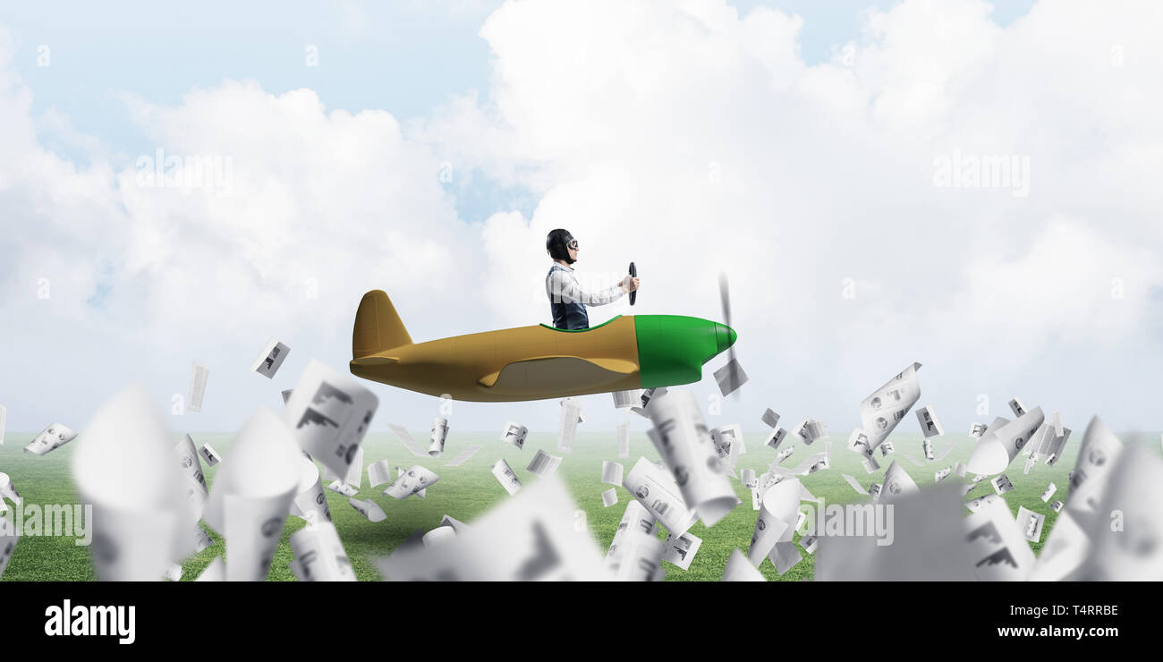 Man in aviator hat and goggles driving propeller plane above falling ...