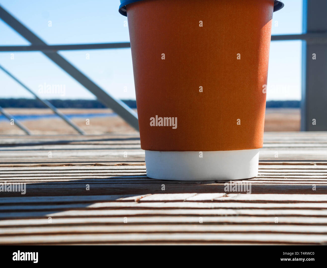 paper cup with lid. Coffe cup on wooden surface. Street coffee, take ...