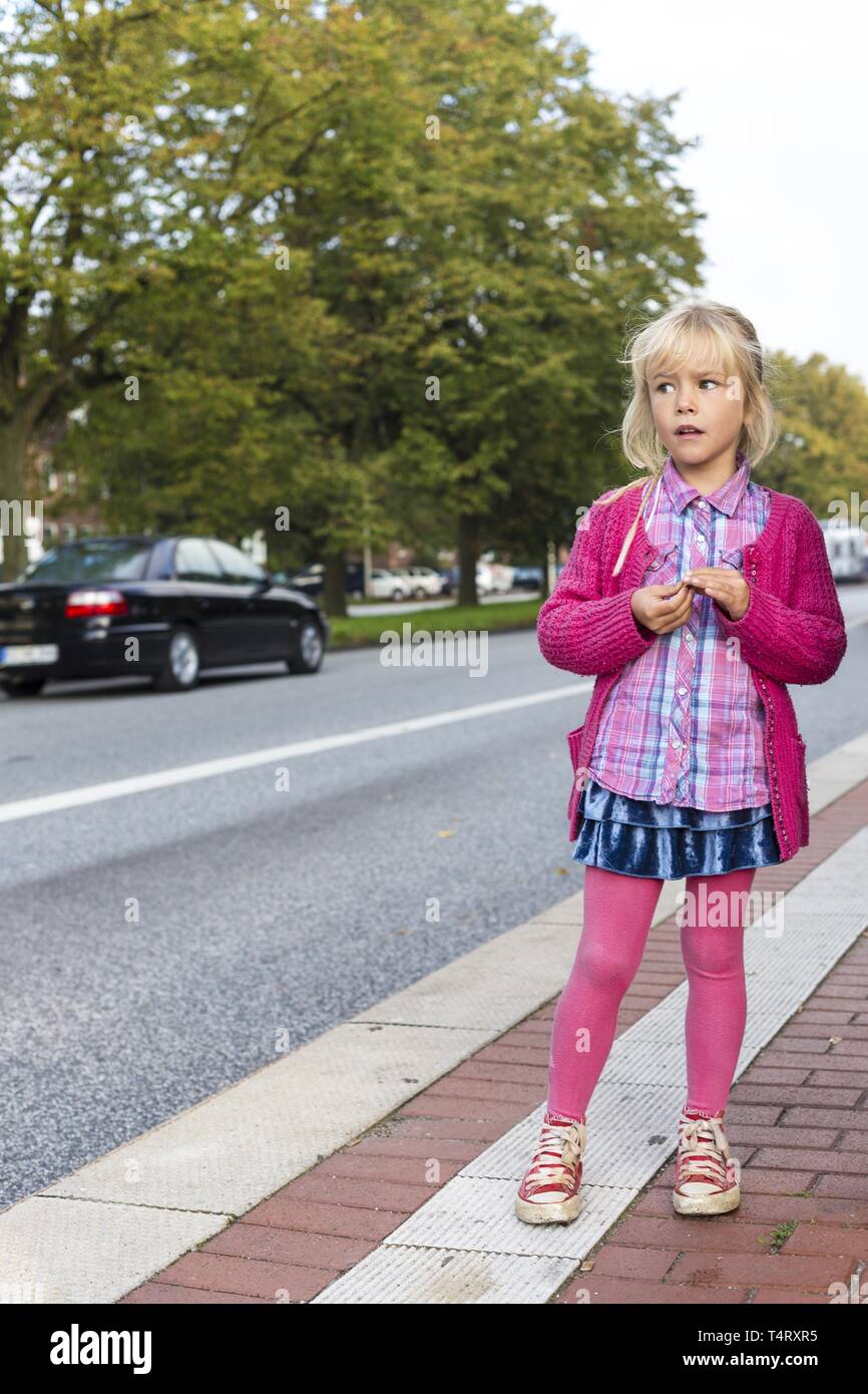 Girl standing at roadside hi-res stock photography and images - Alamy