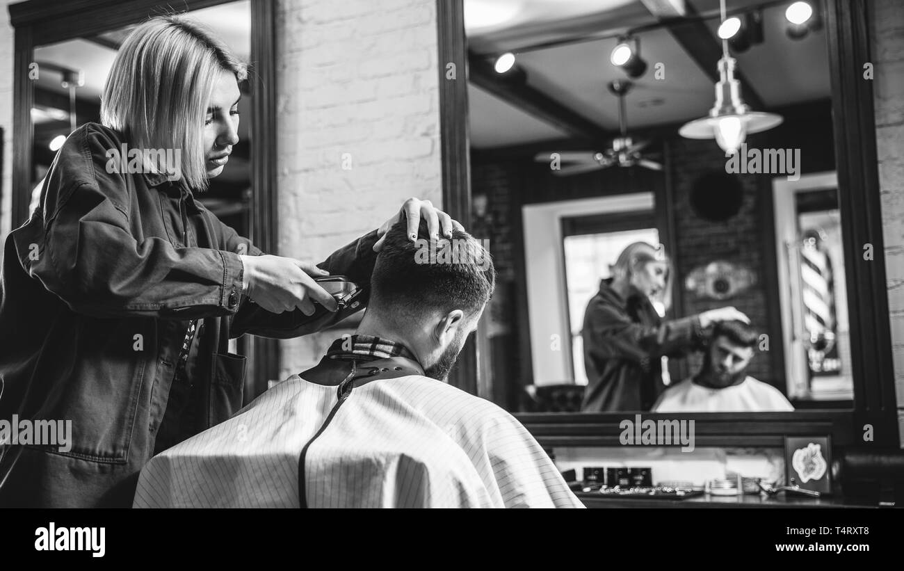 Hairdresser making haircut man Black and White Stock Photos & Images ...