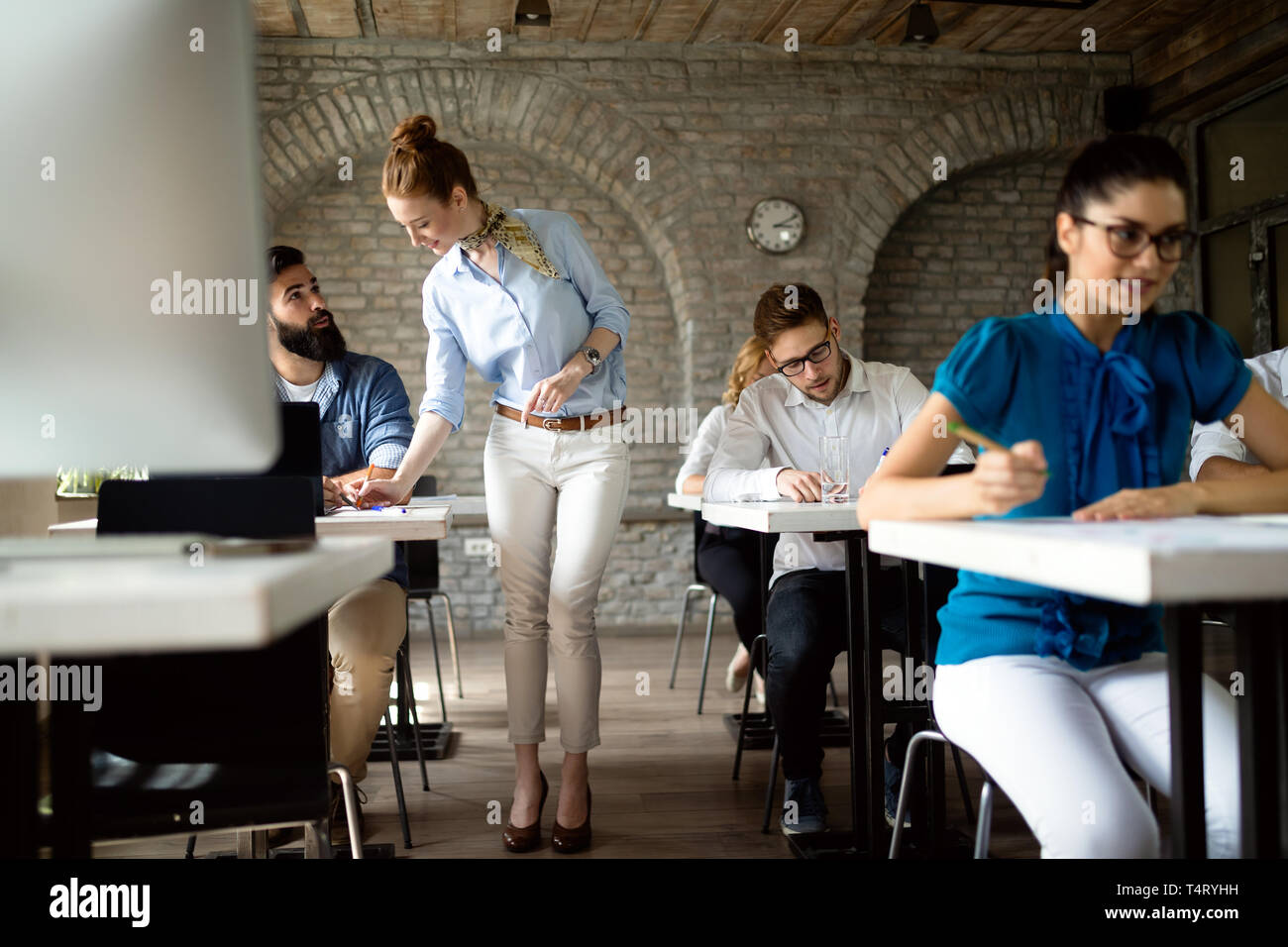 Successful happy group of people learning software engineering and ...