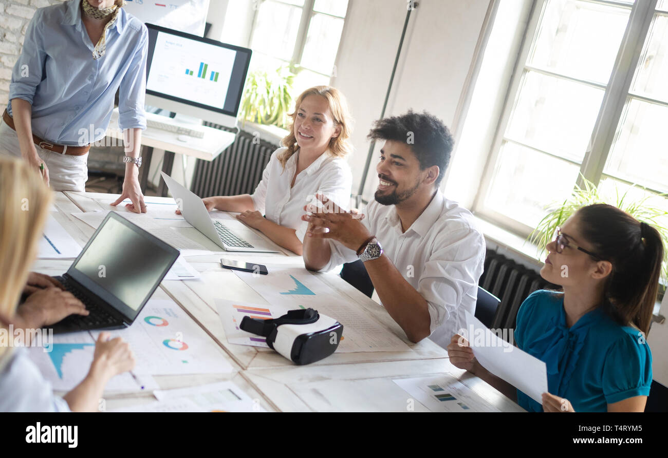 Creative business people working on business project in office Stock ...