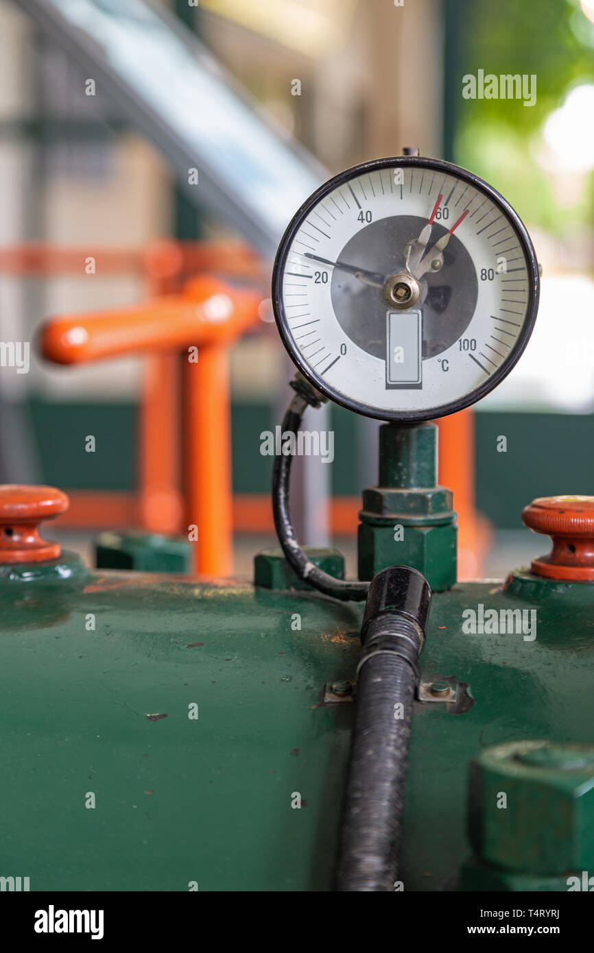Measuring instrument on a historic generator in an old power plant in ...