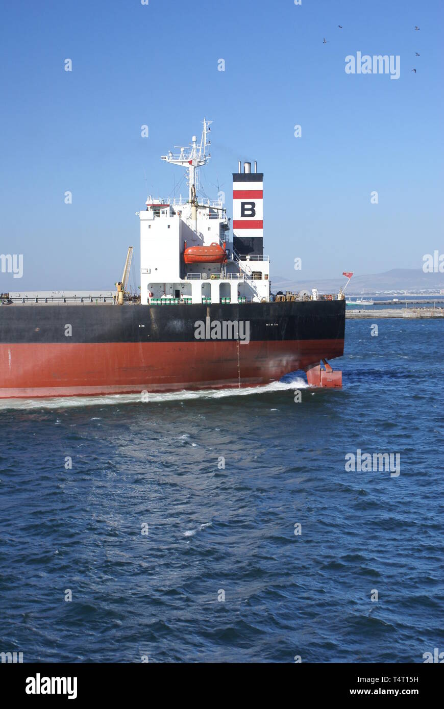 A bulk carrier Carola in the waters of Duncan Dock, port of Cape Town ...