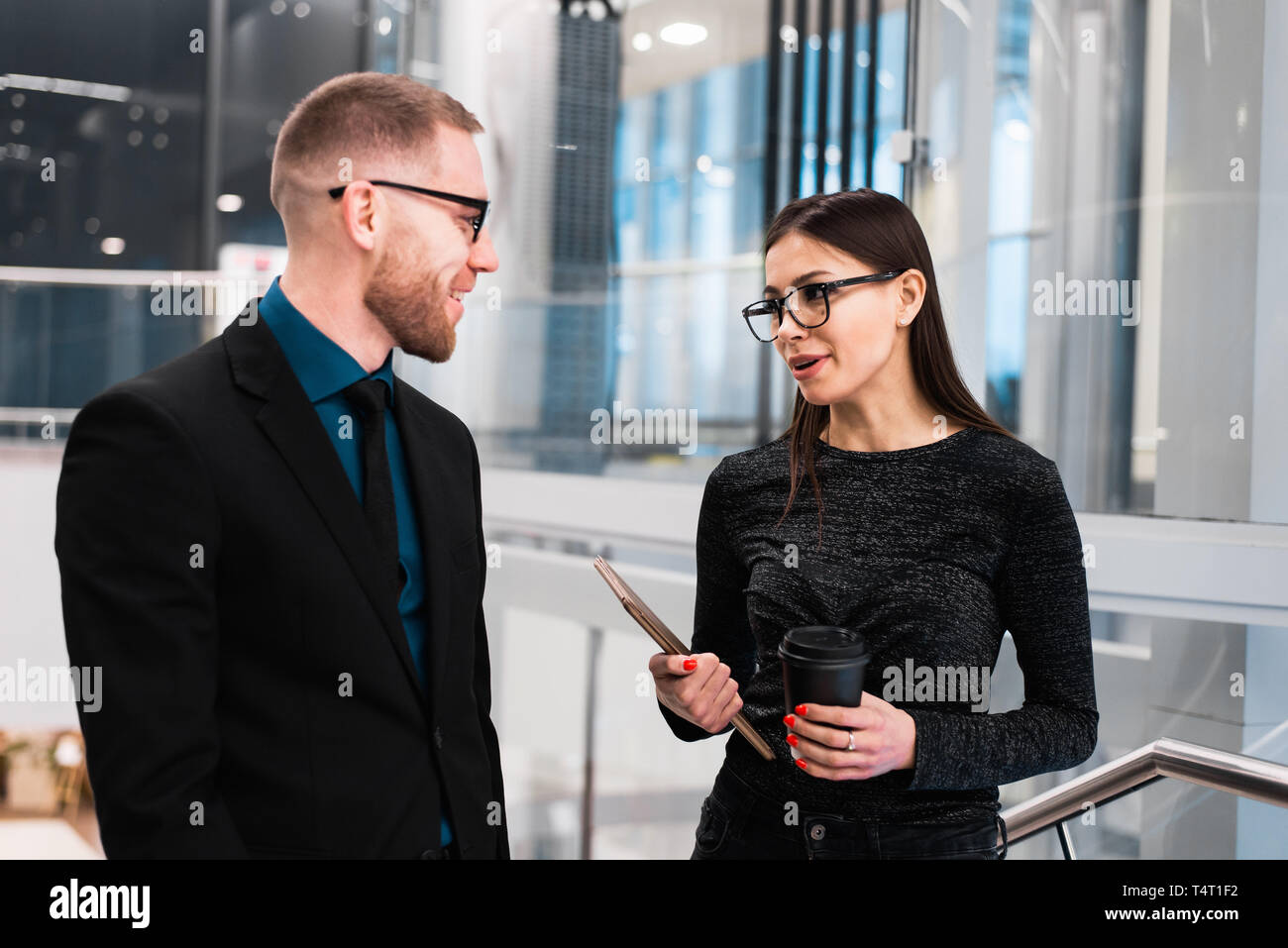 Colleagues discussing something during coffee hi-res stock photography ...