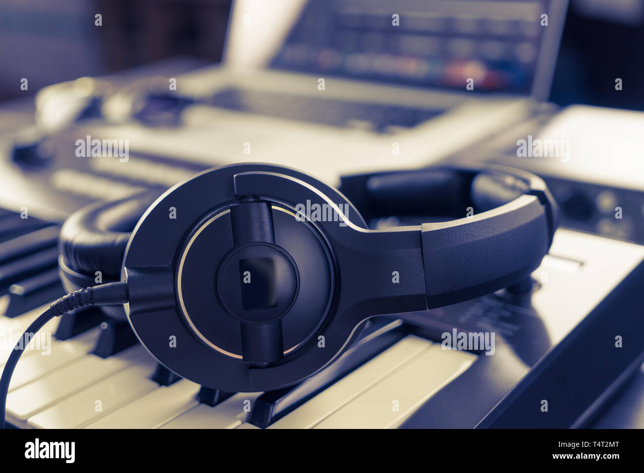 Black headphone on computer music home studio set up Stock Photo - Alamy