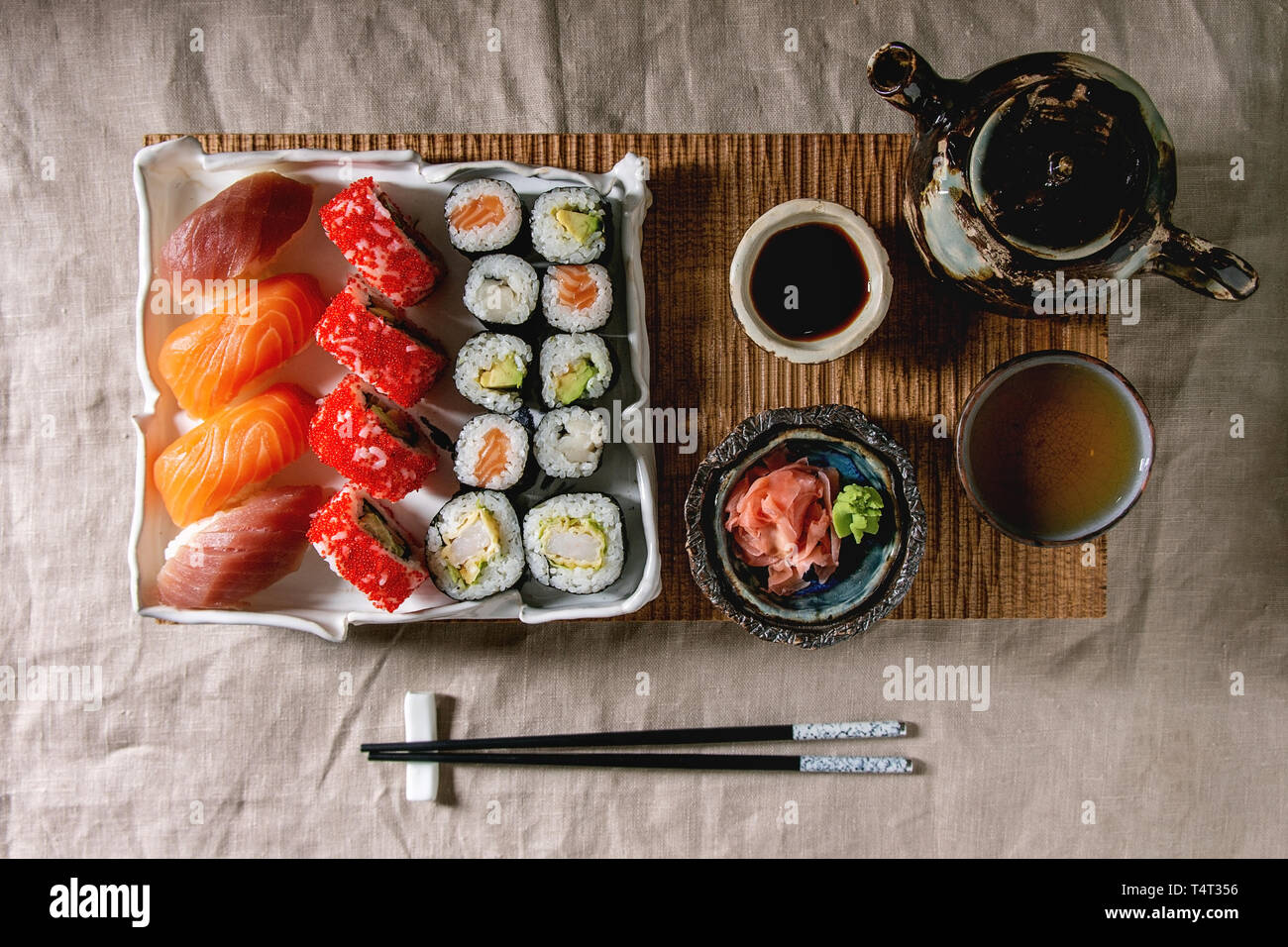 Sushi Set nigiri and sushi rolls on japanese wooden serving board with ...