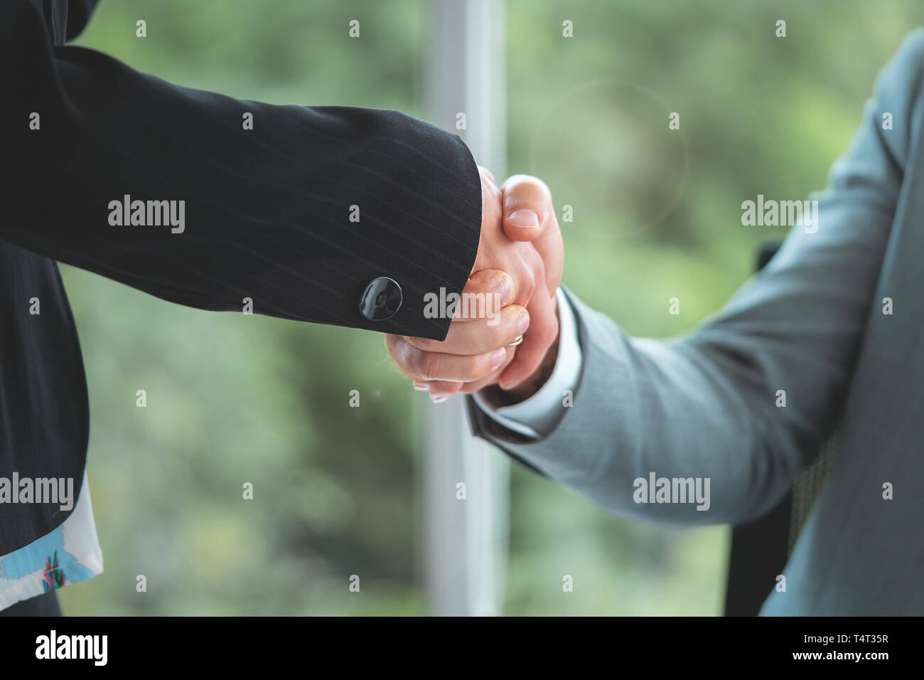 Happy business man with confidence handshake with partner Stock Photo ...