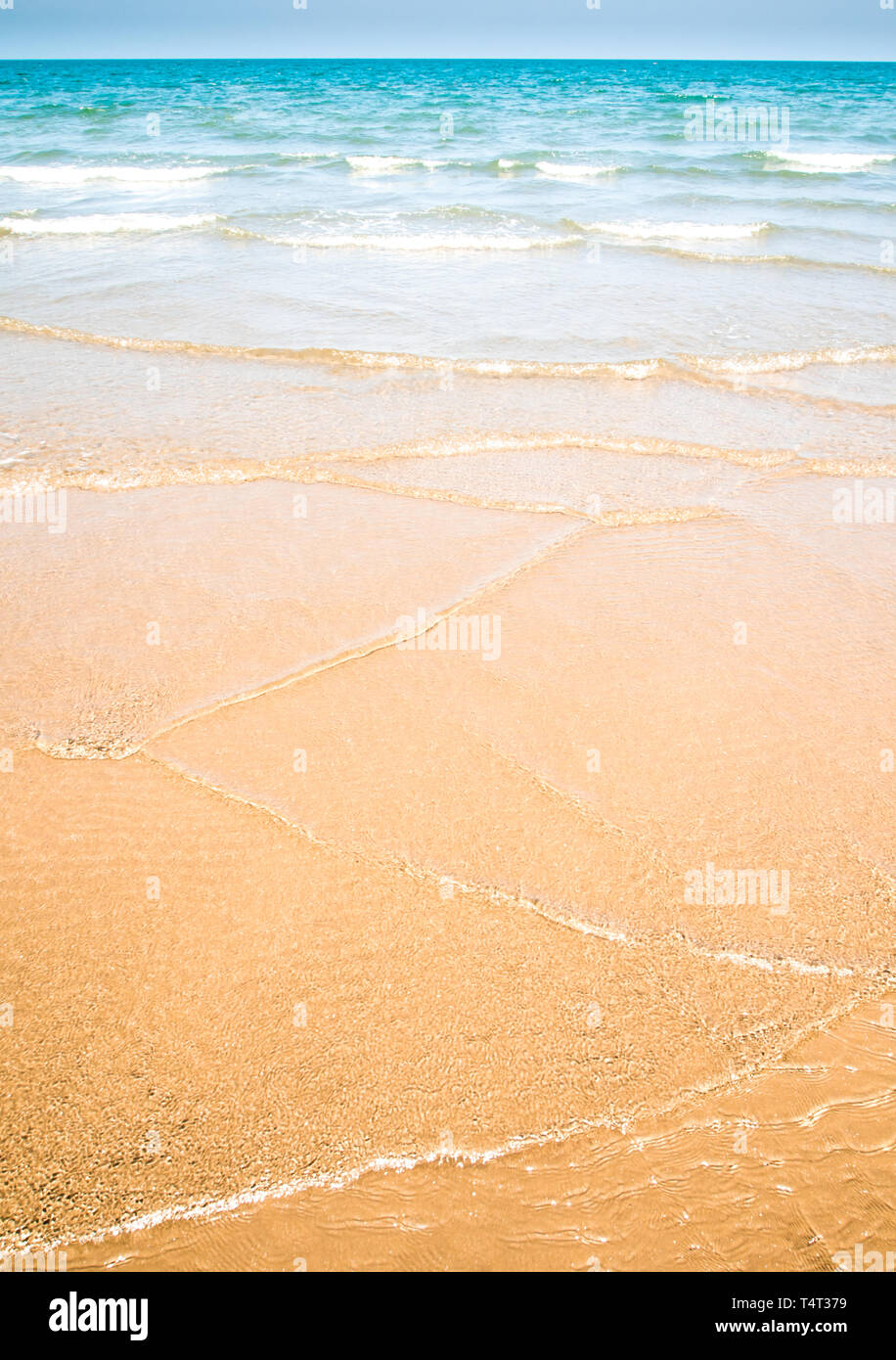 Light reflection on the surface of sea on sand beach Stock Photo - Alamy