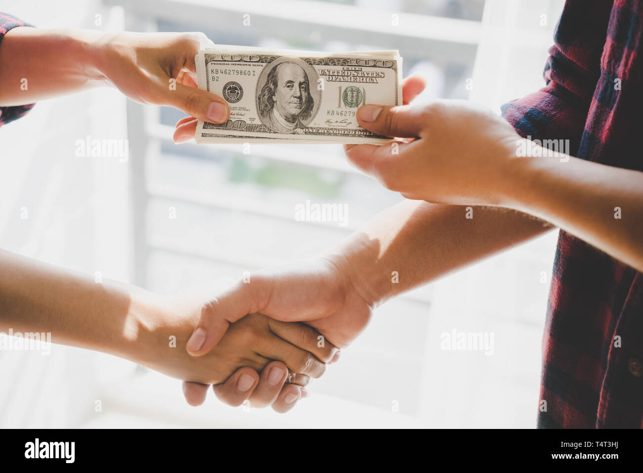 Business man hands handing money over a business dealing Stock Photo ...