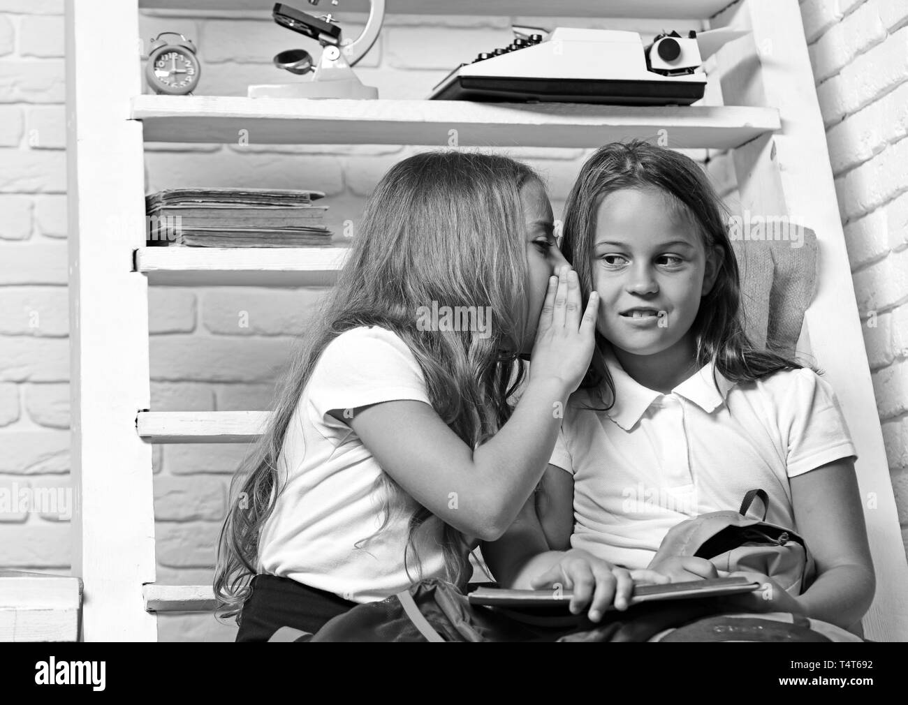Elementary school girls reading a book in class Stock Photo - Alamy