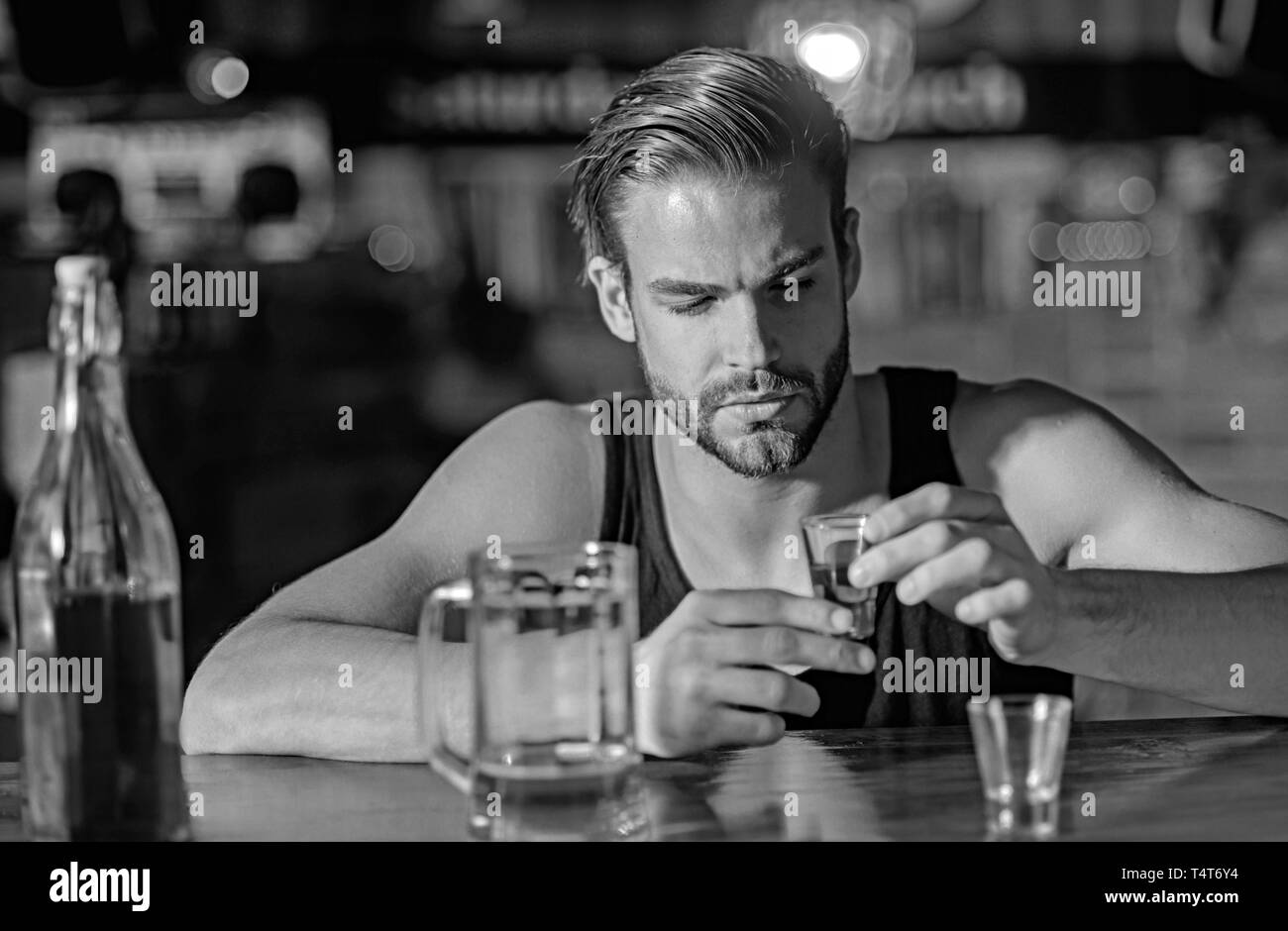 Heavy drinking is bad. Alcoholic man drinking at bar counter. Man drink ...