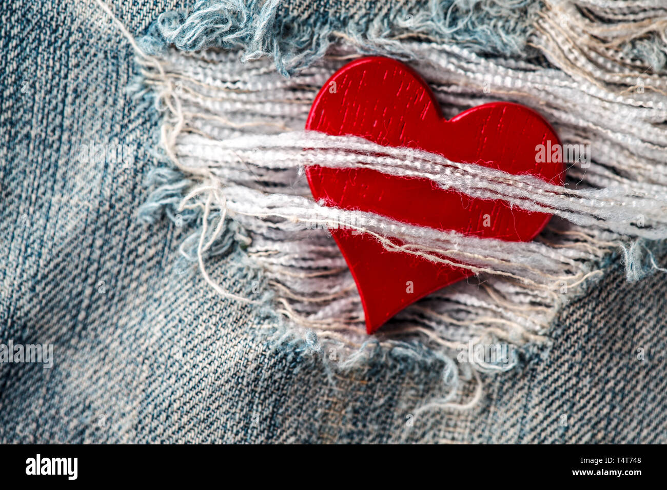 Red Heart On Denim Stock Photo - Alamy