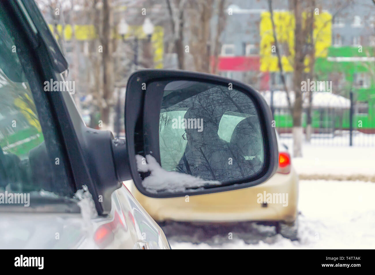 dirty automobile mirror in the winter by white car Stock Photo - Alamy
